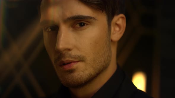 Doubt Guy Standing Indoors. Attractive Man Gazing at Camera in Dark ...