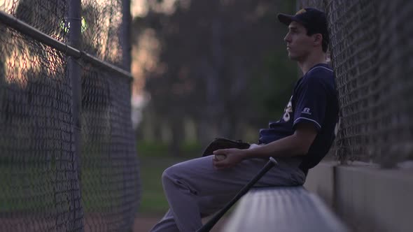 A baseball player resting on the bench., Stock Footage | VideoHive