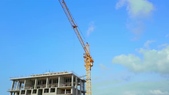 Drone flight construction crane on construction site with constructed ...