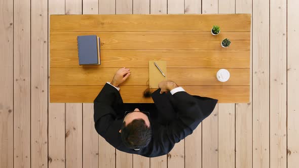 Young Man Tossing Up His Hat on Graduation Day Sitting at the Desk ...