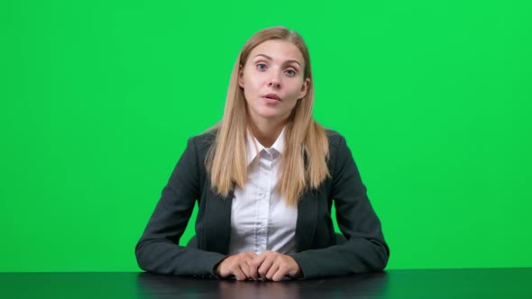 Caucasian Female Interviewer is Sitting at a Table and Talking to an ...