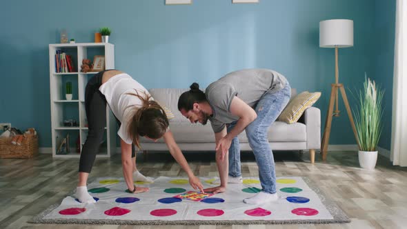 Young Couple Play Twister Game at Home, Stock Footage | VideoHive