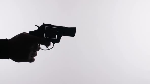 Man with a Gun Picks Up a Wallet, Stock Footage | VideoHive