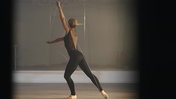 Back View of Confident Ballerina Training in Studio Holding Triangle ...