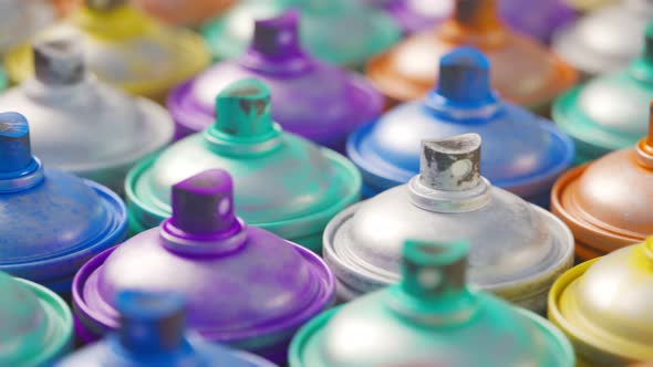 Multiple spray paint cans stacked in a pattern. Infinite looping ...