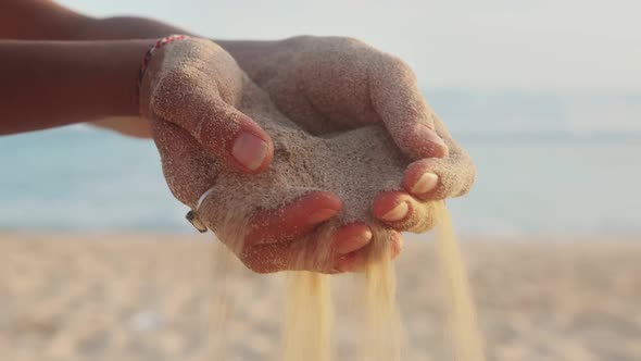 Female Hands Releasing Dropping Sand Grains of Sand are Gently Falling ...