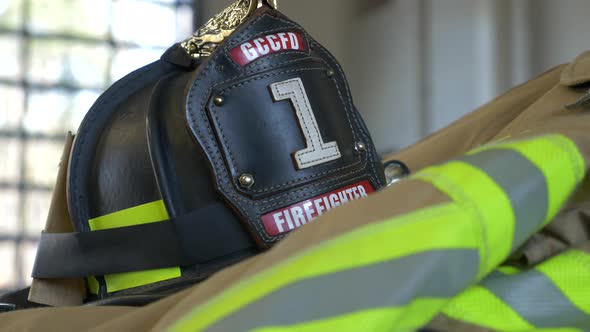 Black firefighter helmet on top of a protective fire coat inside a fire ...
