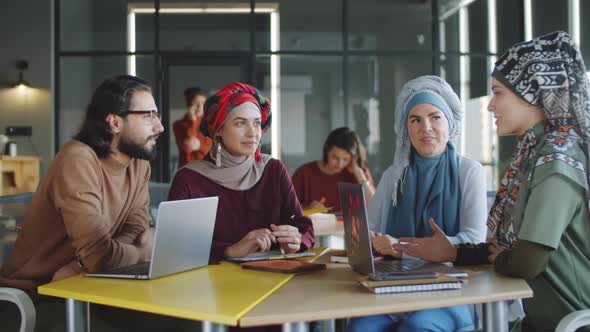 Muslim Colleagues Discussing Business at Office Meeting, Stock Footage