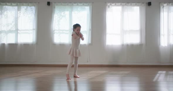 Little girl dancing alone in a studio, Stock Footage | VideoHive