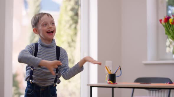 Carefree Cheerful Autistic Boy Dancing Laughing on the Left Indoors ...