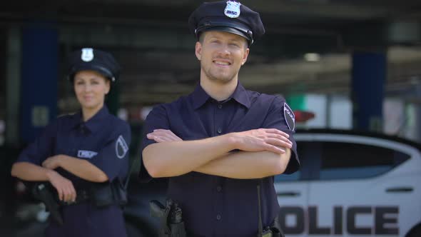 Kind Police Officers Smiling Standing Near Police Station, Ready to ...
