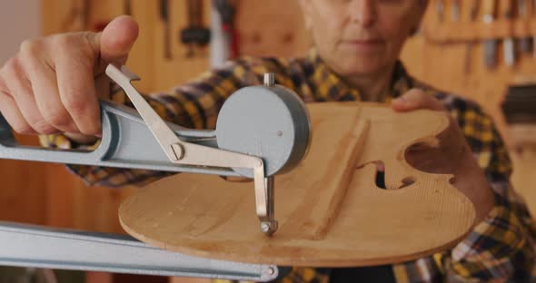 Female luthier at work in her workshop, Stock Footage | VideoHive