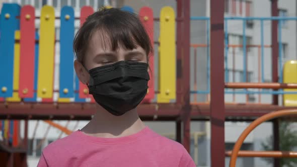 Masked Child on the Playground., Stock Footage | VideoHive