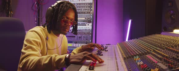 African American Sound Engineer Working in Recording Studio, Stock Footage