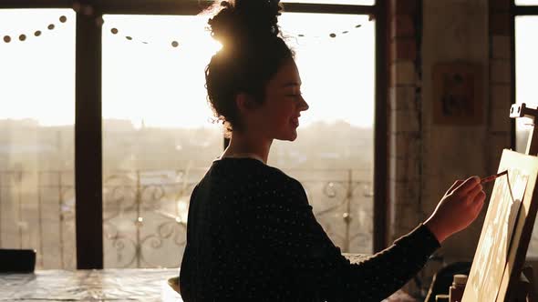 Young Gifted Female Artist Smiling While Working on Creating Something ...