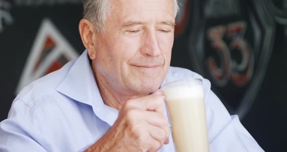 Senior Man Having Milkshake in Cafe 4k, Stock Footage | VideoHive