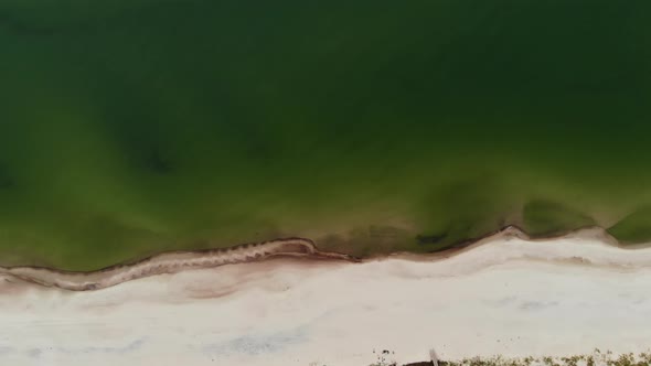 AERIAL: View of a Beach and Green Color Sea From Above on a Sunny Day ...
