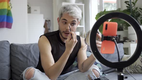 Drag queen streaming online make up tutorial with smartphone indoors at ...