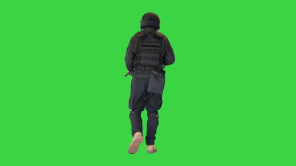 Spec Ops Police Officer SWAT with a Rifle Walking on a Green Screen ...