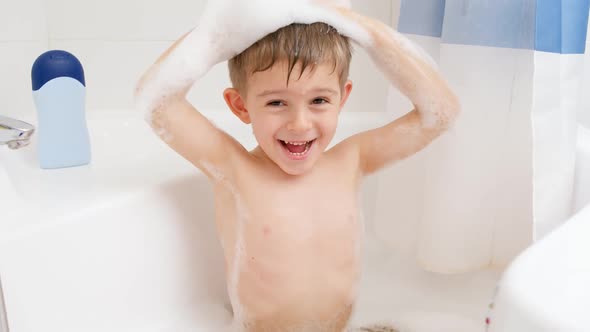 SLow Motion of Happy Funny Little Boy Washing His Head with Shampoo ...