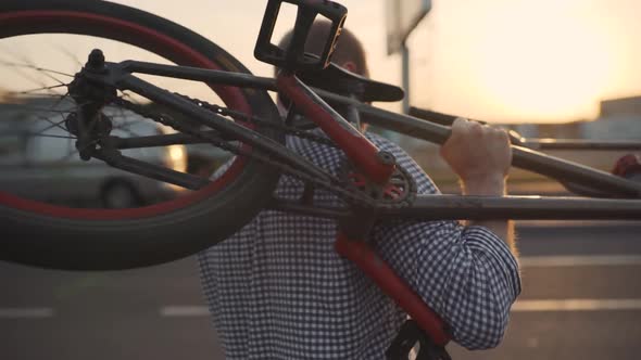 Slow Motion Video of Stylish Young Man Carrying Broken Bmx Bicycle and ...
