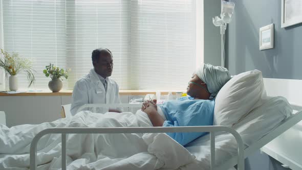 Careful Doctor Supporting Female Patient in Clinic, Stock Footage ...