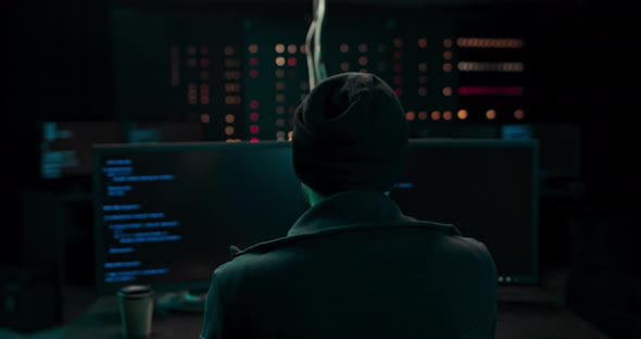 Hacker In Headset Awith Keyboard Hacking Computer System Or Programming Hideout Place Has Dark 