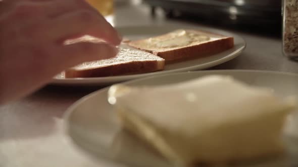 Toast With Butter. Hands Applying Butter On Bread Closeup, Stock Footage