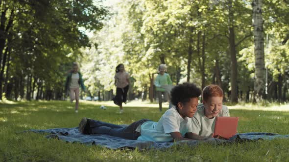 School Girls Joining Boys in Park, Stock Footage | VideoHive