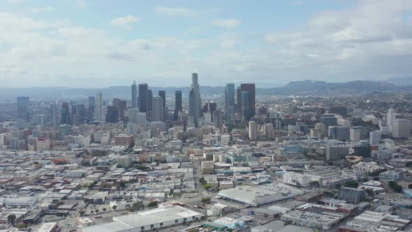 AERIAL: Slow Side Shot of Downtown Los Angeles Skyline with Warehouse ...