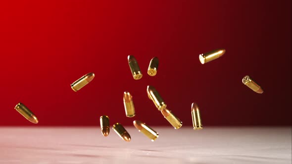 Bullets falling bouncing in ultra slow motion 1500fps on a reflective ...