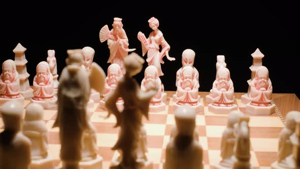 Dolly left through Chess Ivory pieces, Chessboard game concept. Black ...