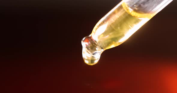 Clear Yellow Liquid Dripping From Pipette Slow Motion Movie, Stock Footage