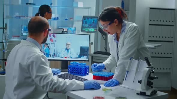 Lab Technicians Talking on Video Call with Professional Chemist Doctor ...