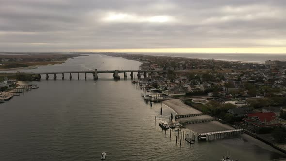An aerial shot over the East Rockaway Inlet in NY. The drone dolly in ...