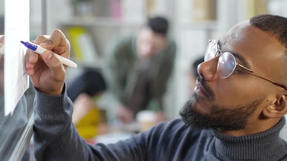 Black Analyst Drawing Freehand Data Graph, Stock Footage | VideoHive