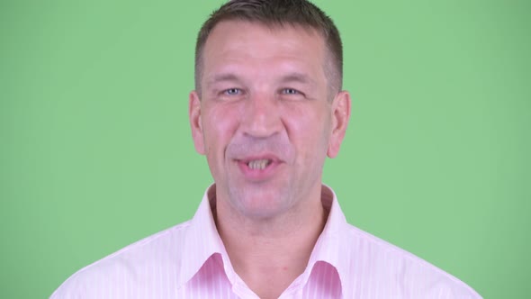 Face of Happy Mature Macho Businessman Nodding Head Yes, Stock Footage