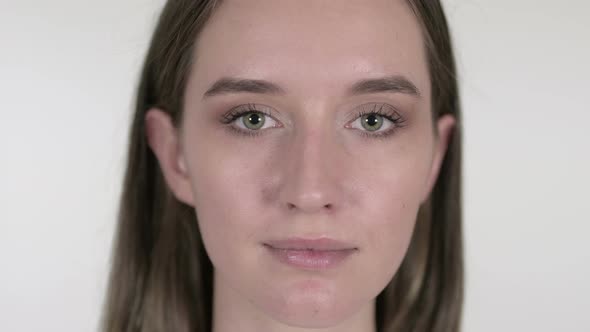 Close Up of Smiling Woman Winking Eyes, White Background, Stock Footage