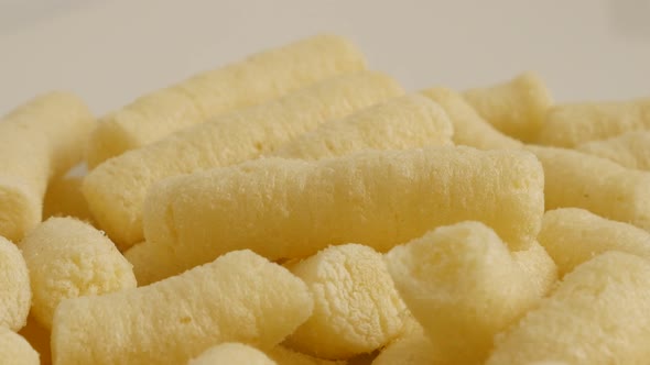 Tasty corn flips puffs unhealthy food close-up 4K 2160p 30fps UltraHD ...