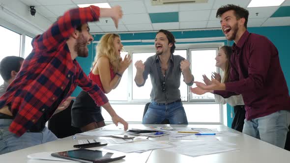 career, start up - coworkers in meeting cheer on the approval of their ...