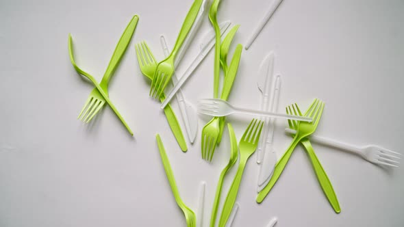 Lots Plastic Forks and Eating Utensils Are Falling on White Background ...