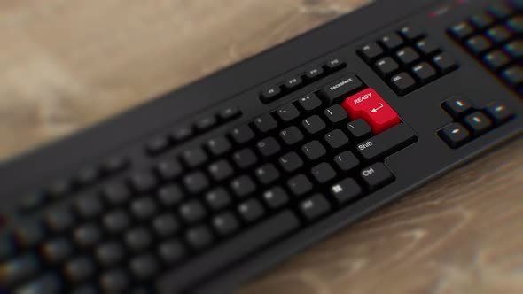 Ready button on keyboard. Wideshot. A finger presses Enter. Click ready ...