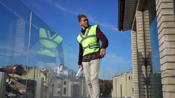 Positive African American Builder Singing Dancing on Rooftop in ...