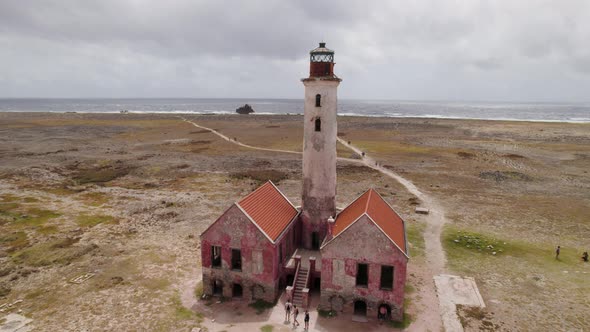 Aerial close orbit over the old lighthouse on Klein Curacao island in ...