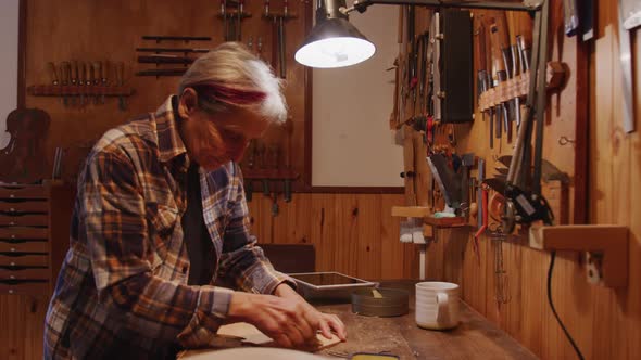 Female luthier at work in her workshop, Stock Footage | VideoHive