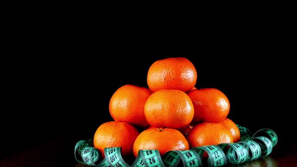 Mandarin And Tape Measure Turning , Stock Footage | VideoHive