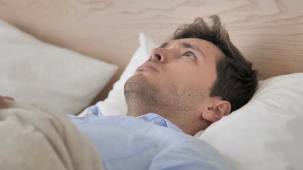 Uncomfortable Man Waking up from Sleep in Bed, Stock Footage | VideoHive