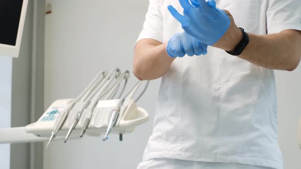 The Doctor is Preparing for Surgery He Wears Rubber Surgical Gloves ...