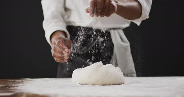 Video of cook throwing flour on the table on black background, Stock ...