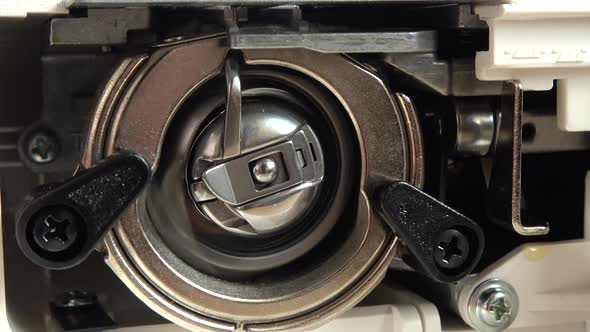 Elements of the sewing machine mechanism at work. Internal parts of a ...